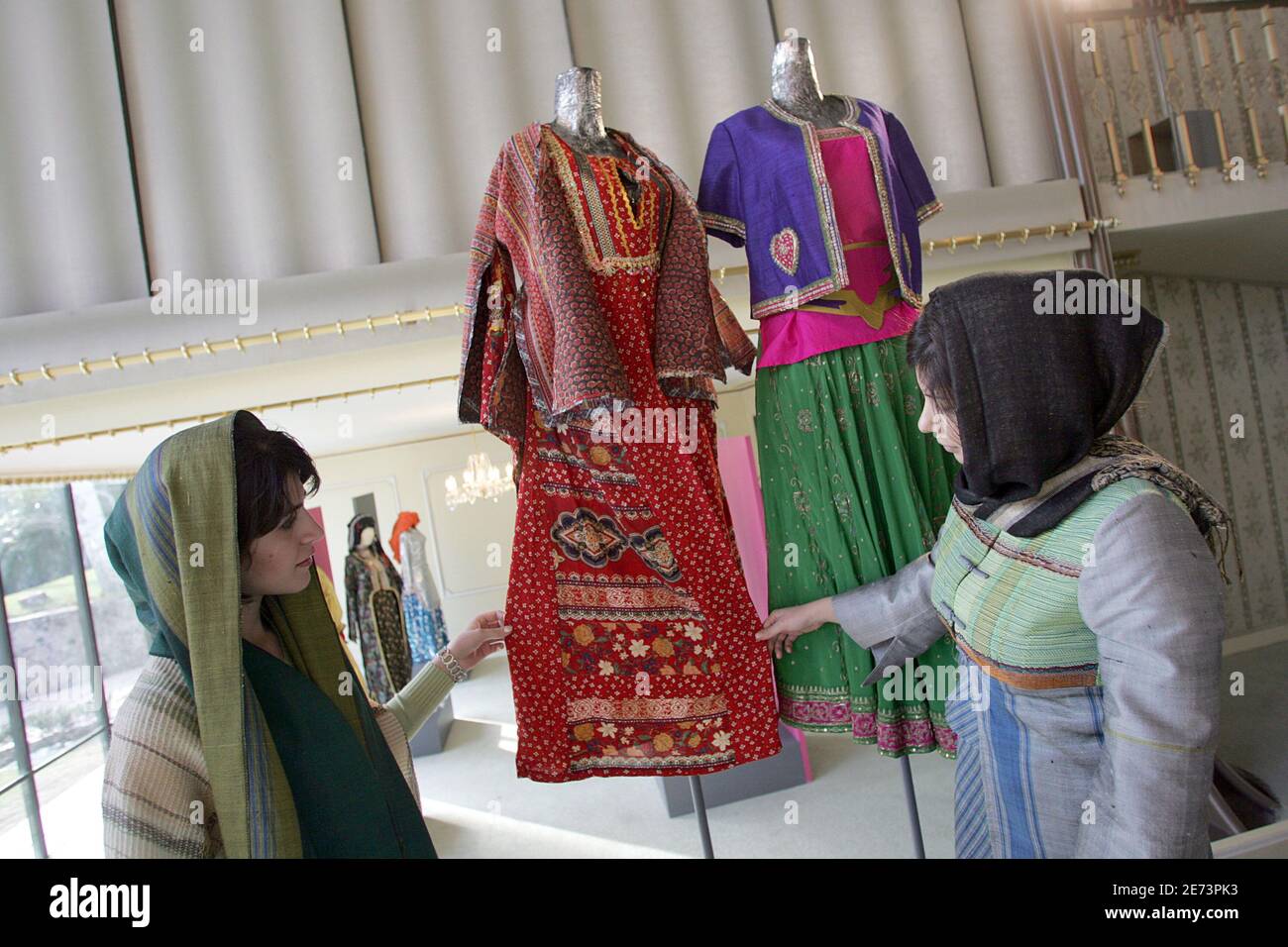 "Iranian models Mahsa (L) and Sanaz (R) watch locally-designed ...