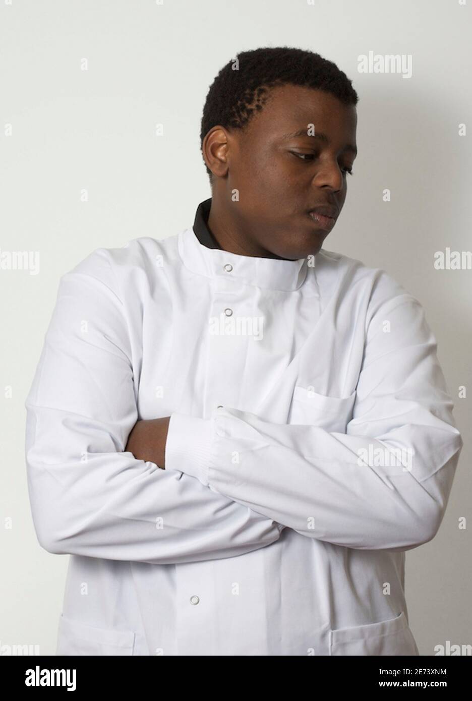 Black man lab coat thinking hi-res stock photography and images - Alamy