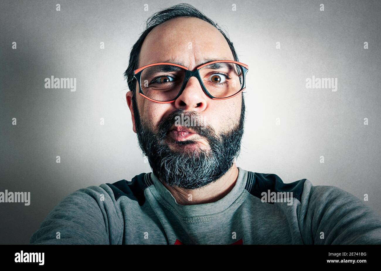 Funny man with the beard making expressions Stock Photo - Alamy