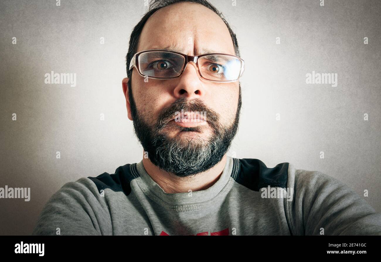 Funny man with the beard making expressions Stock Photo - Alamy