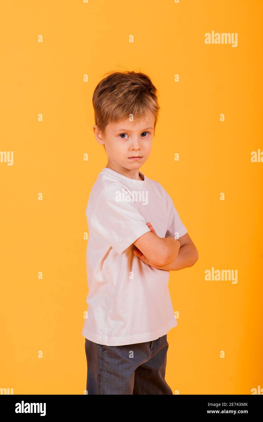 Funny kid, handsome little boy, surprised nine years old child, studio ...