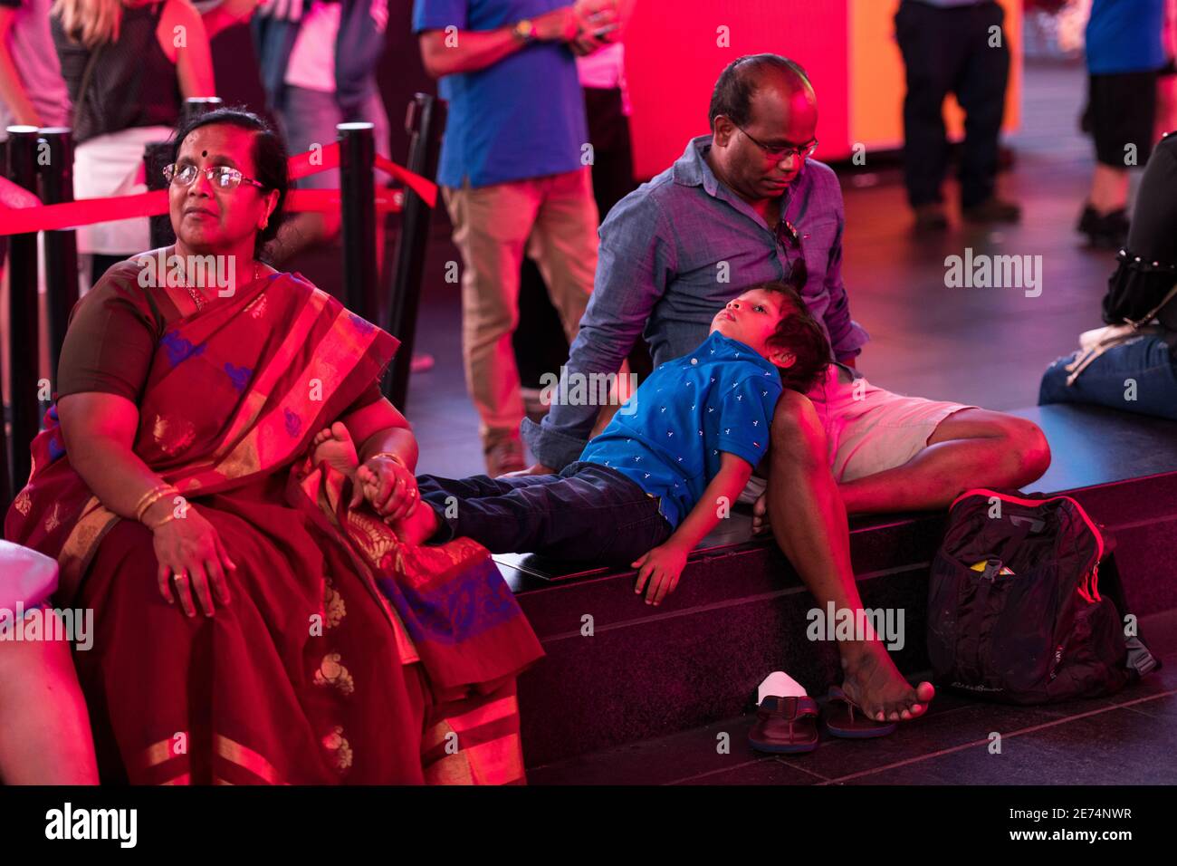 New York, USA. 24 Jun, 2019. An exhausted family in Times Square early ...