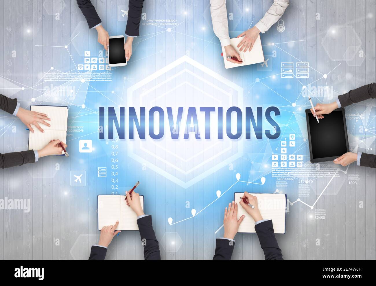 Group of Busy People Working in an Office with INNOVATIONS inscription ...