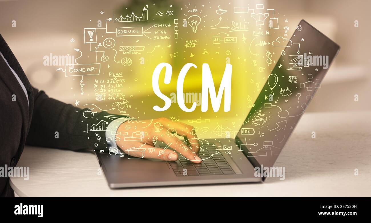 hand working on new modern computer with SCM abbreviation, modern ...