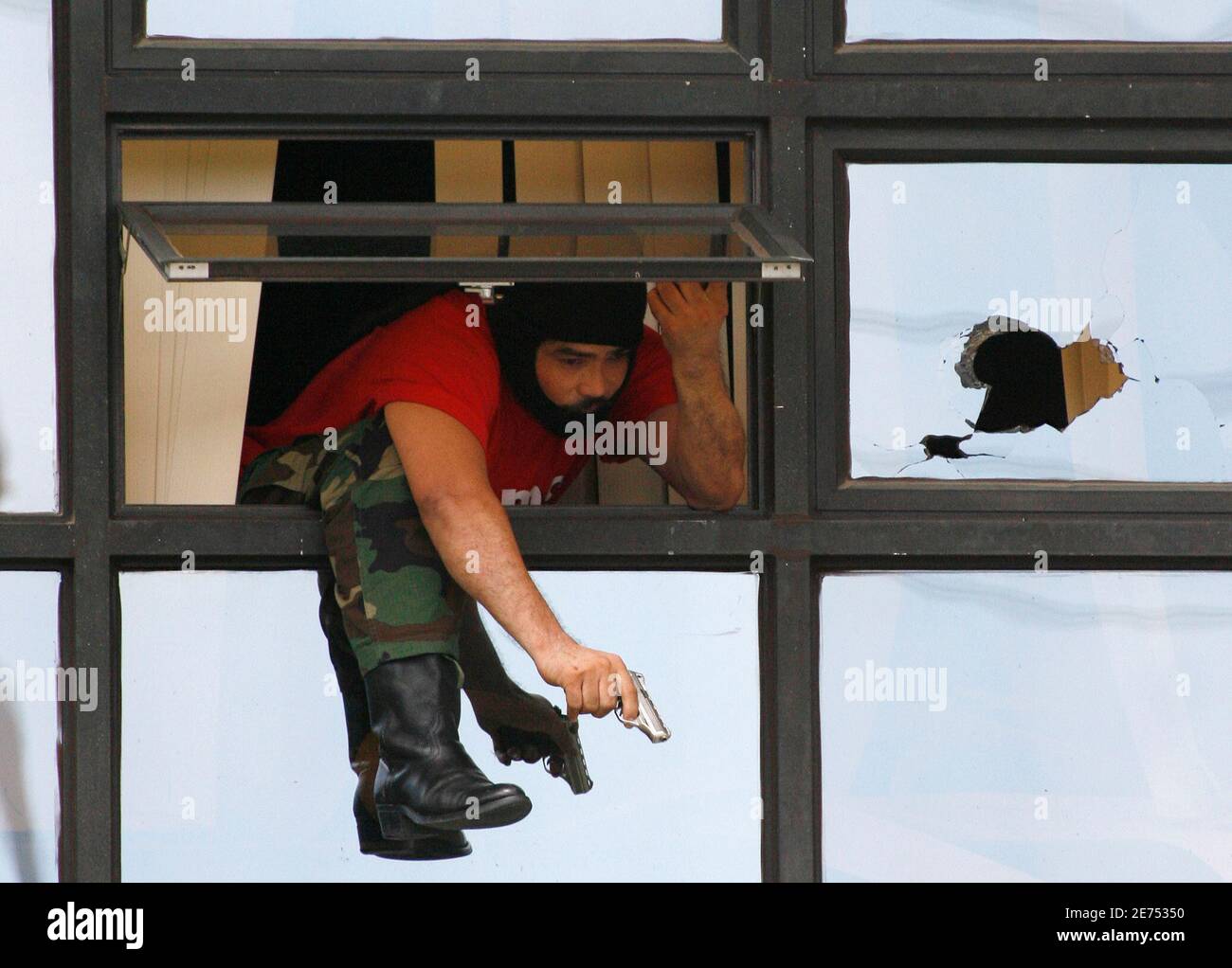 Man climb through window hi-res stock photography and images - Alamy