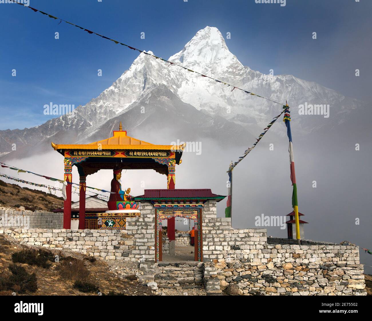 New statue of buddha in Pangboche monastery and mount Ama Dablam ...