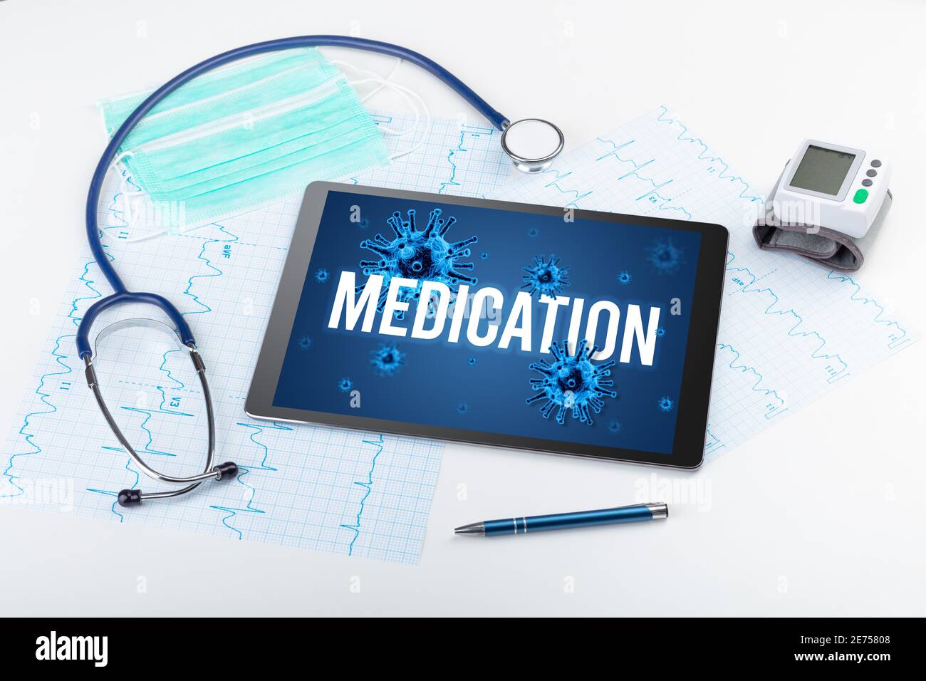 Tablet pc and doctor tools on white surface with MEDICATION inscription ...