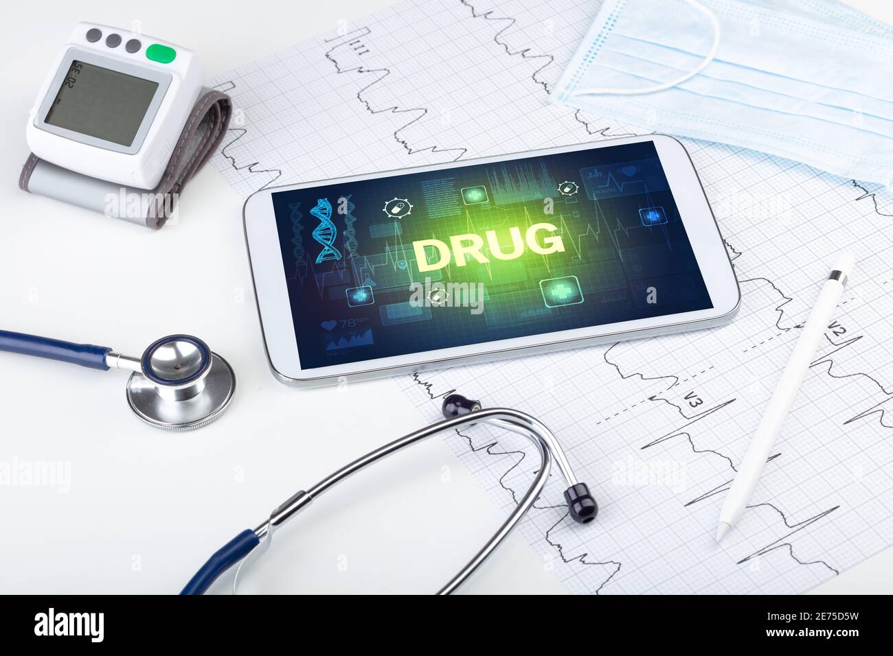 Tablet pc and medical stuff with DRUG inscription, prevention concept ...