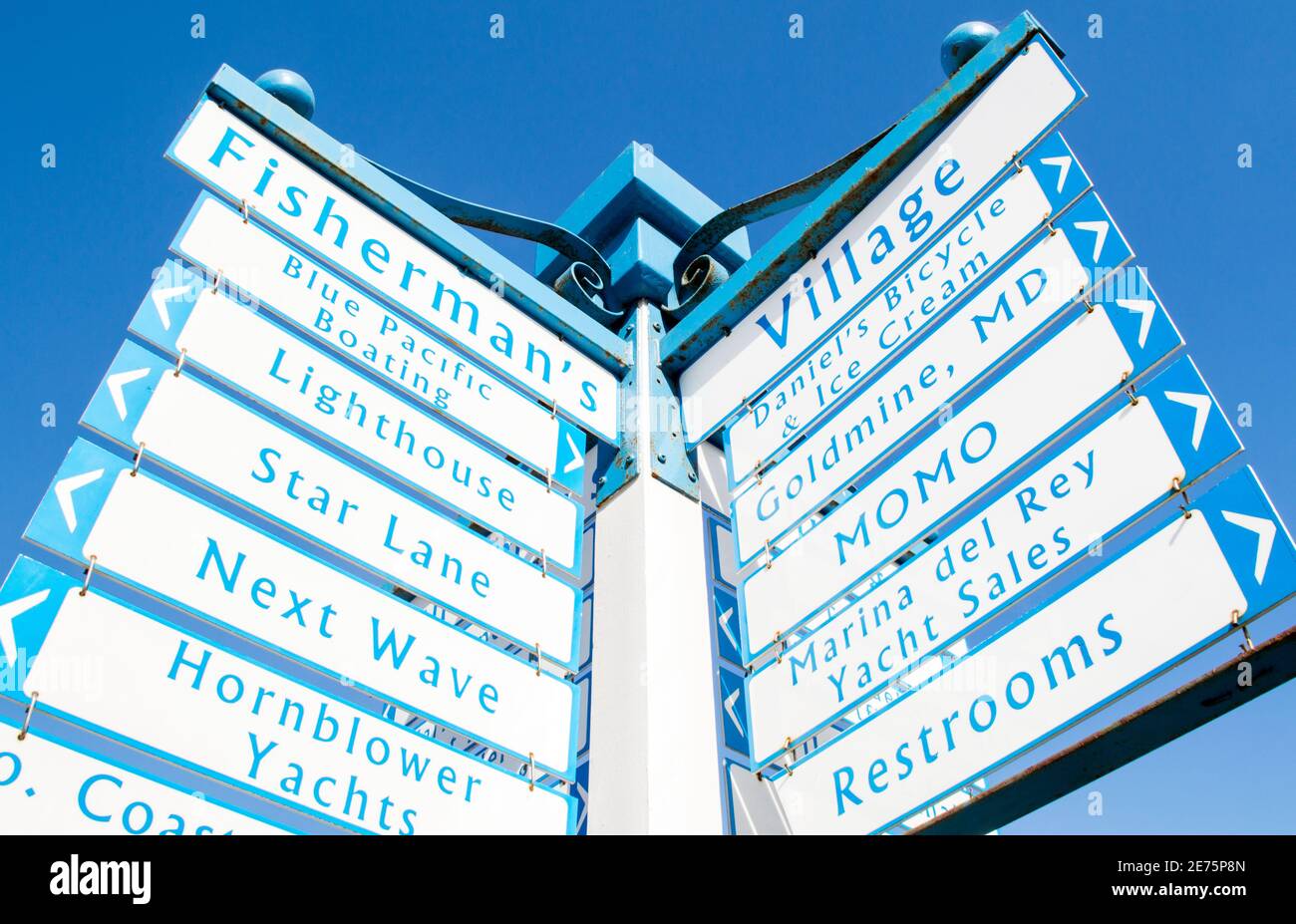a vintage sign board pointing to the businesses at Fisherman's Village ...