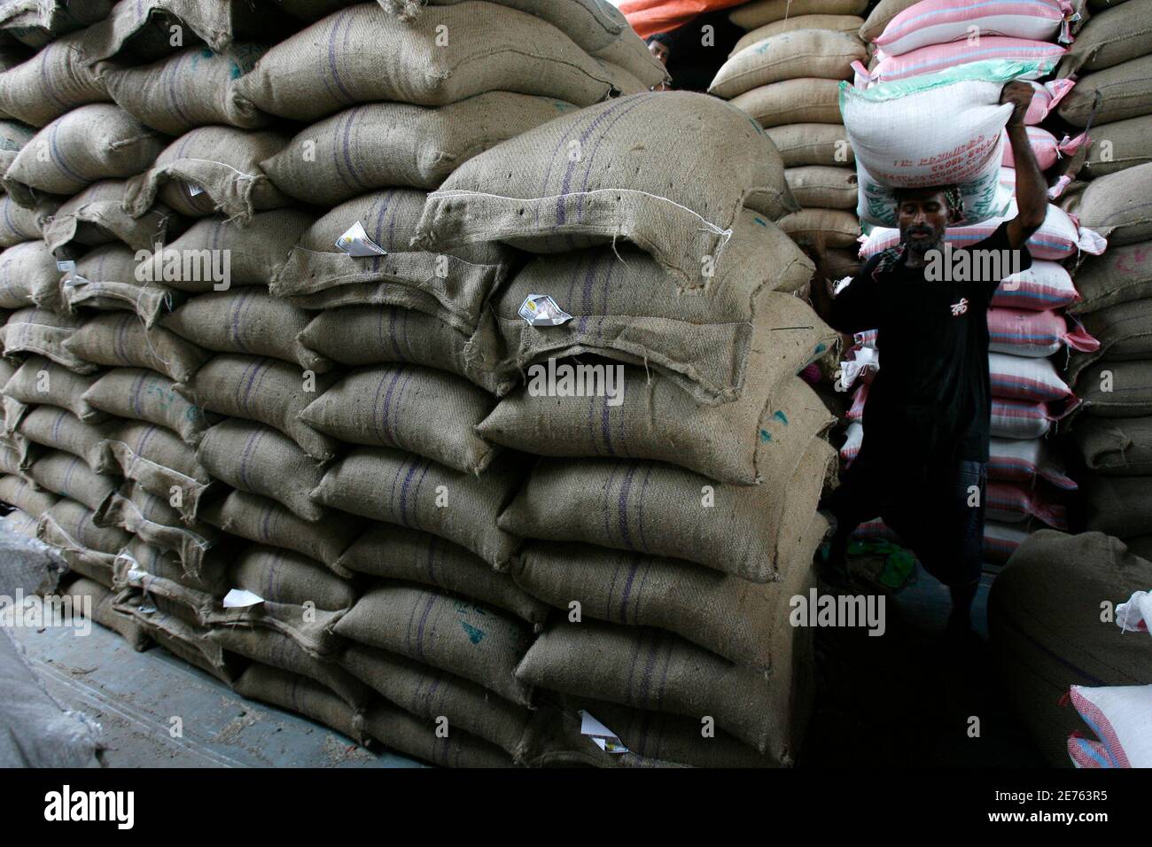 Man carrying a rice bag High Resolution Stock Photography and Images ...