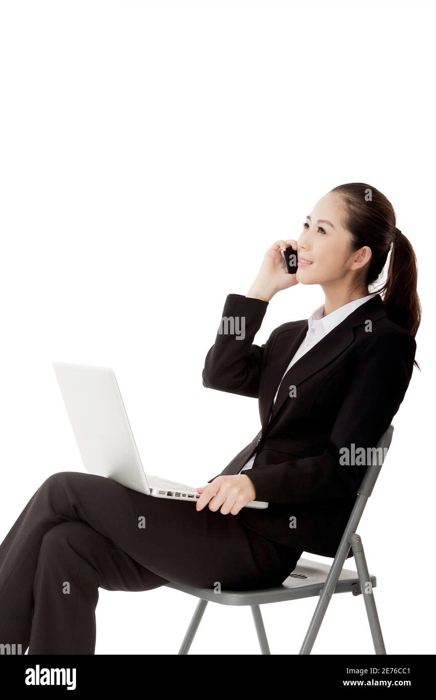 Smiling business lady sitting hi-res stock photography and images - Alamy