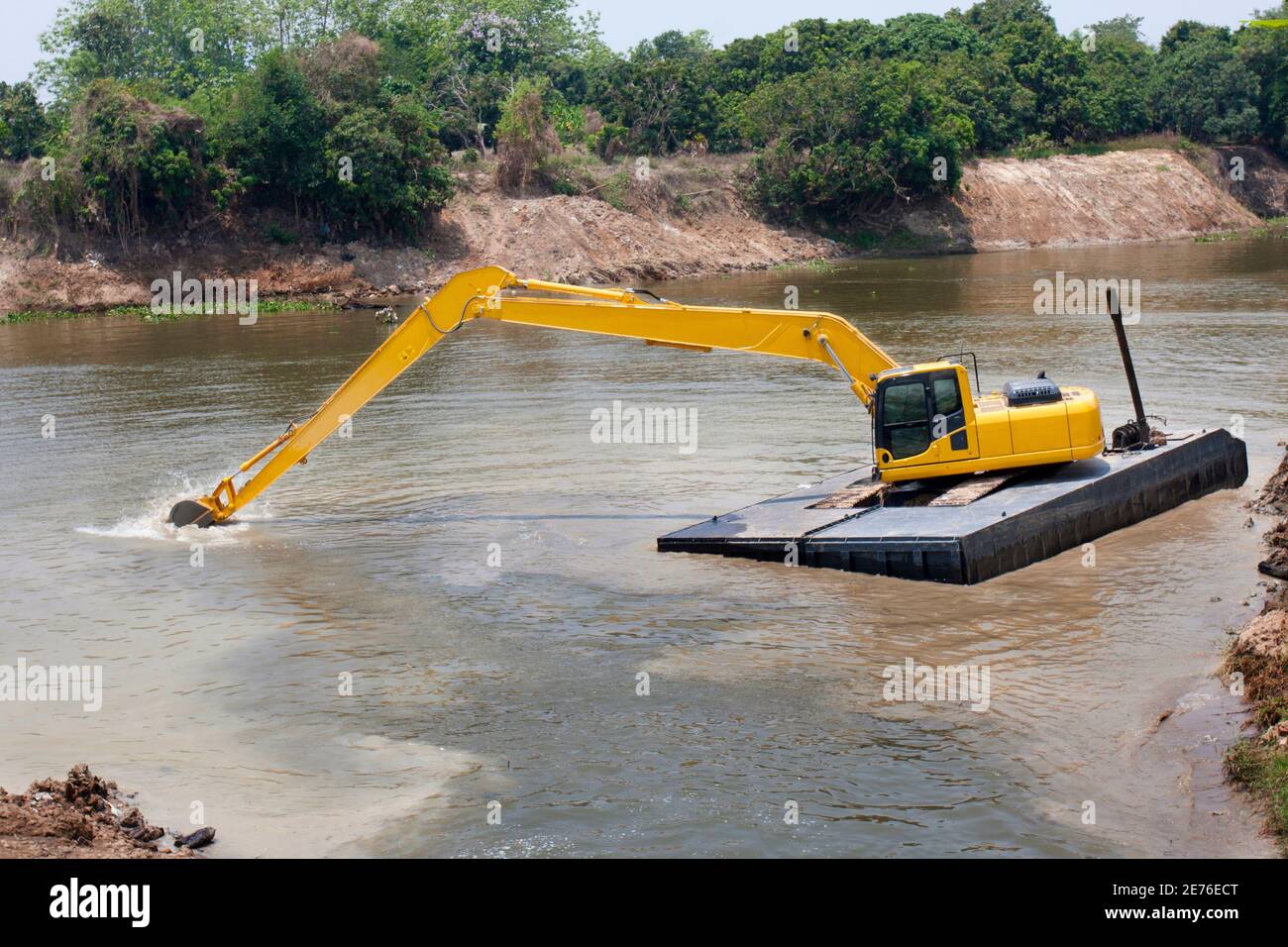 excavator machine works at river for protect flood Stock Photo - Alamy