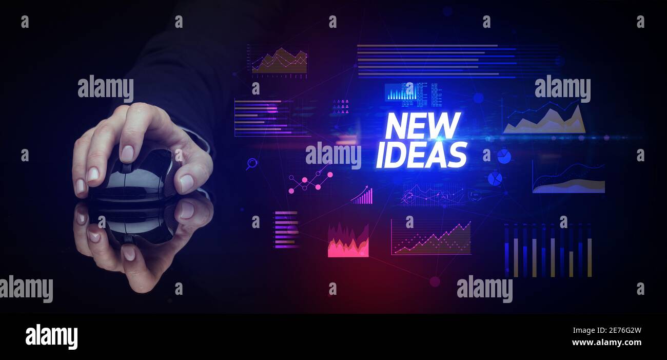 hand holding wireless peripheral with NEW IDEAS inscription, cyber ...