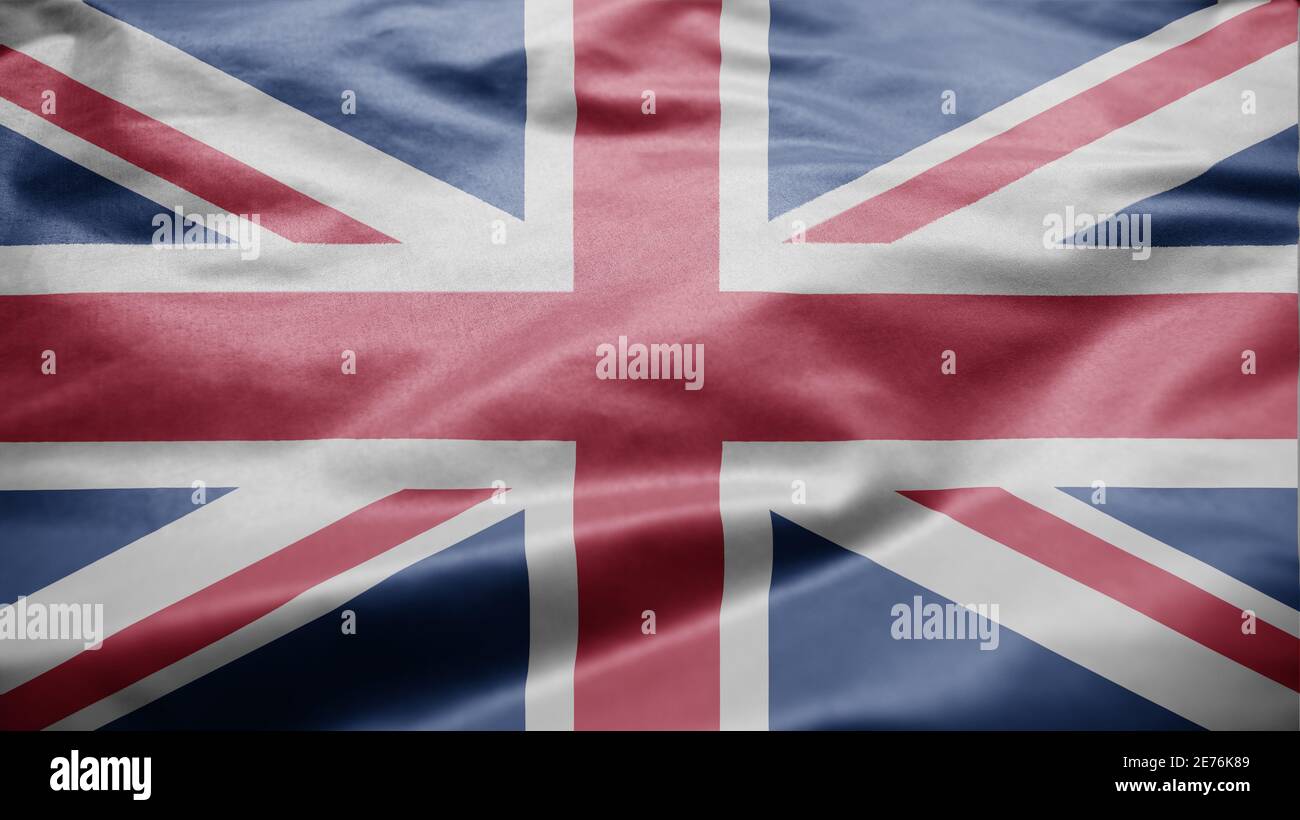 United Kingdom flag waving in the wind. Close up of Britain banner ...