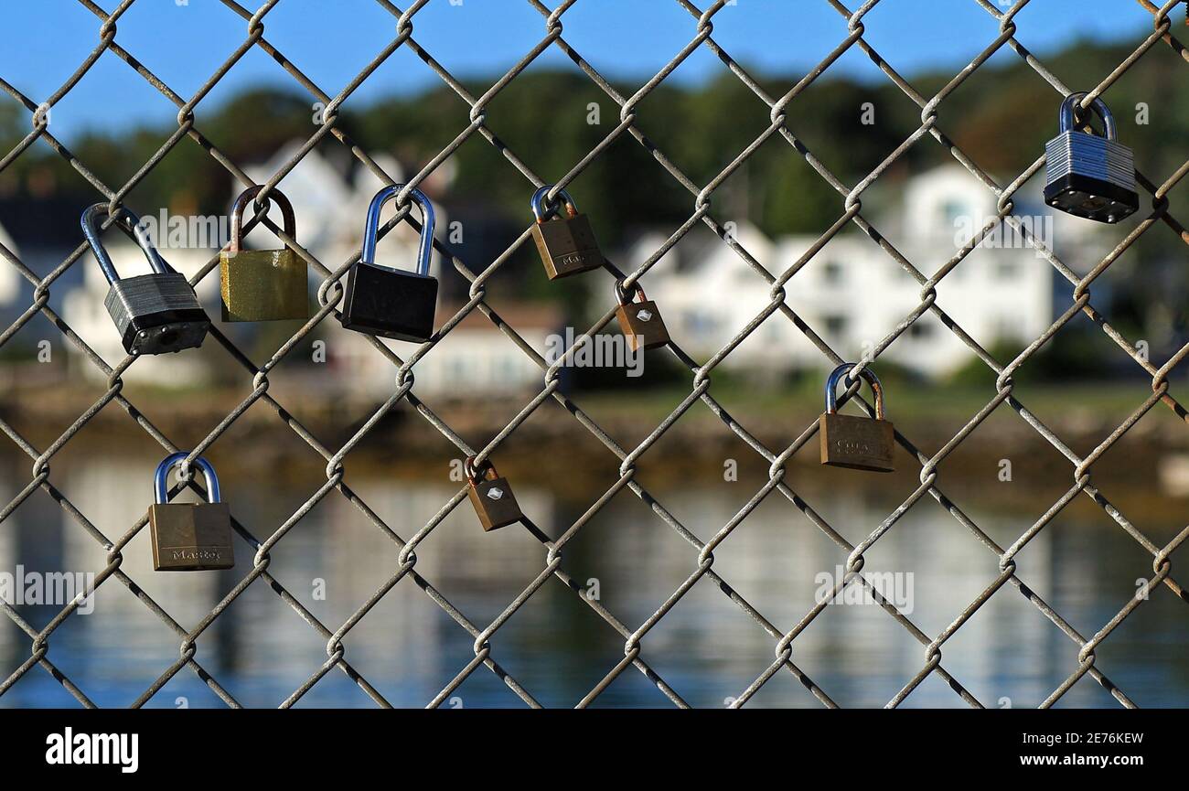 Locks on a chain link fence hi-res stock photography and images - Alamy