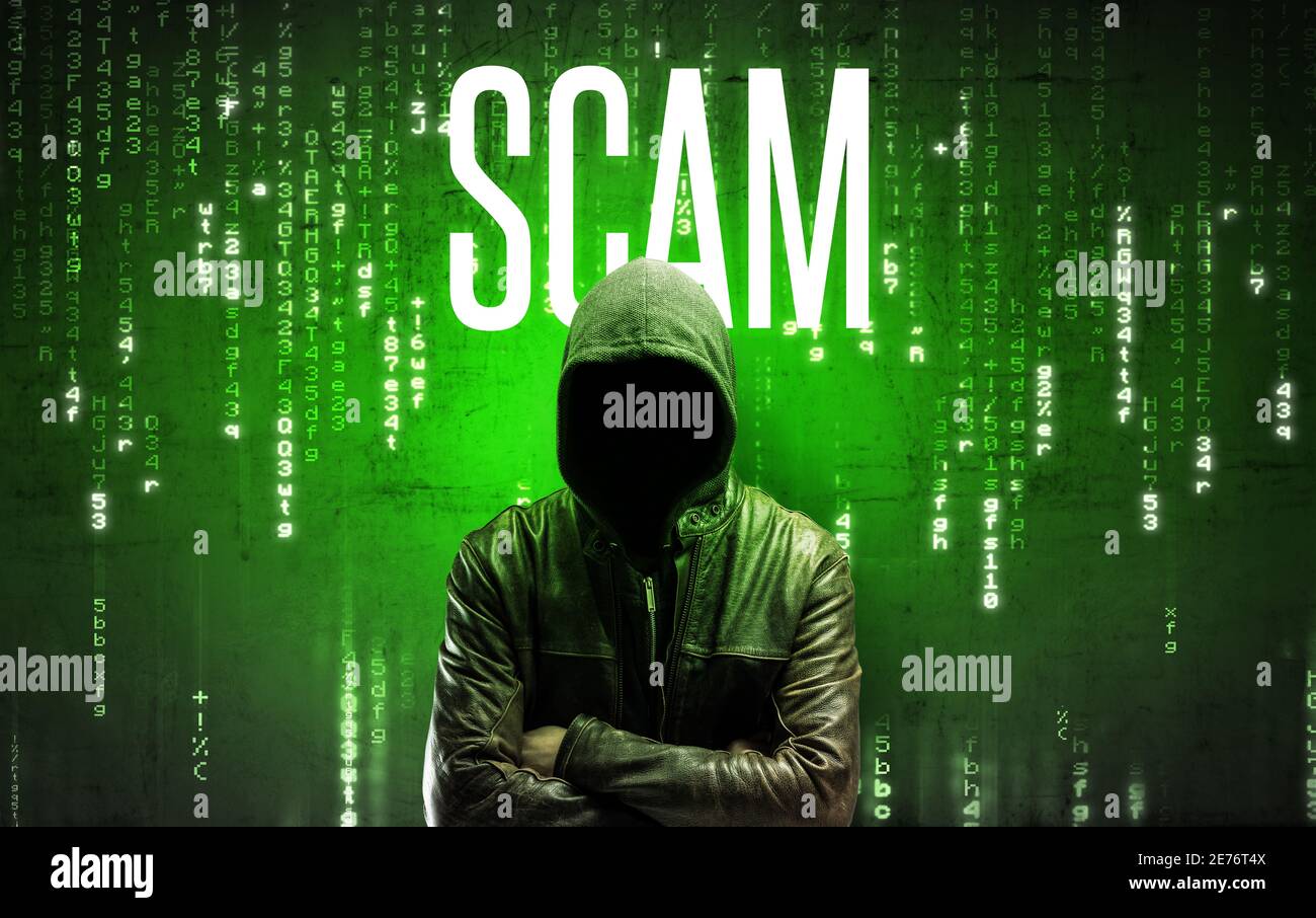 Faceless hacker with SCAM inscription, hacking concept Stock Photo - Alamy