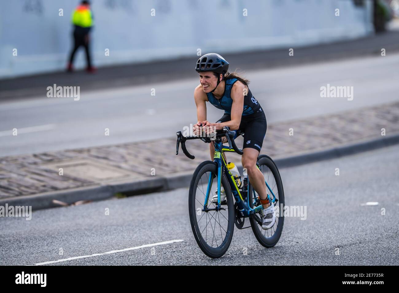 Grace Thek seen riding the bike during the 2XU Triathlon Series 2021 ...
