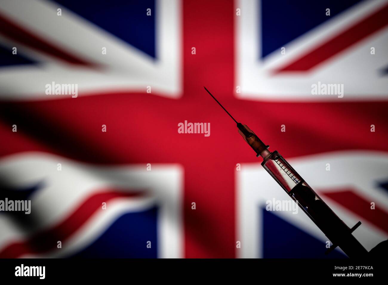 In this photo illustration a medical syringe with Pfizer-BioNtech COVID ...