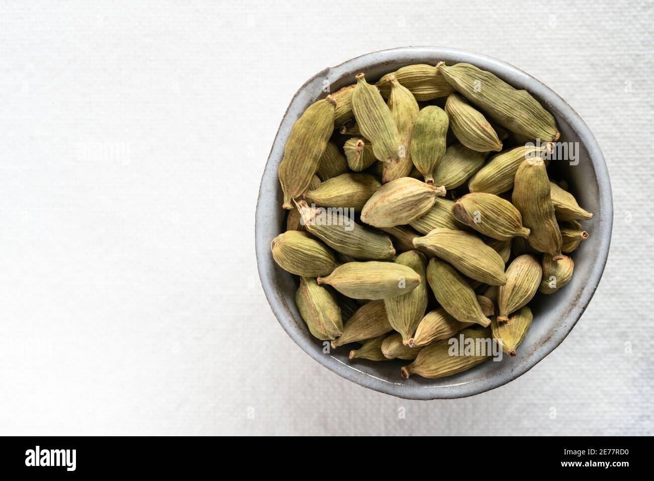 Green Cardamom Pods in a Bowl Stock Photo - Alamy