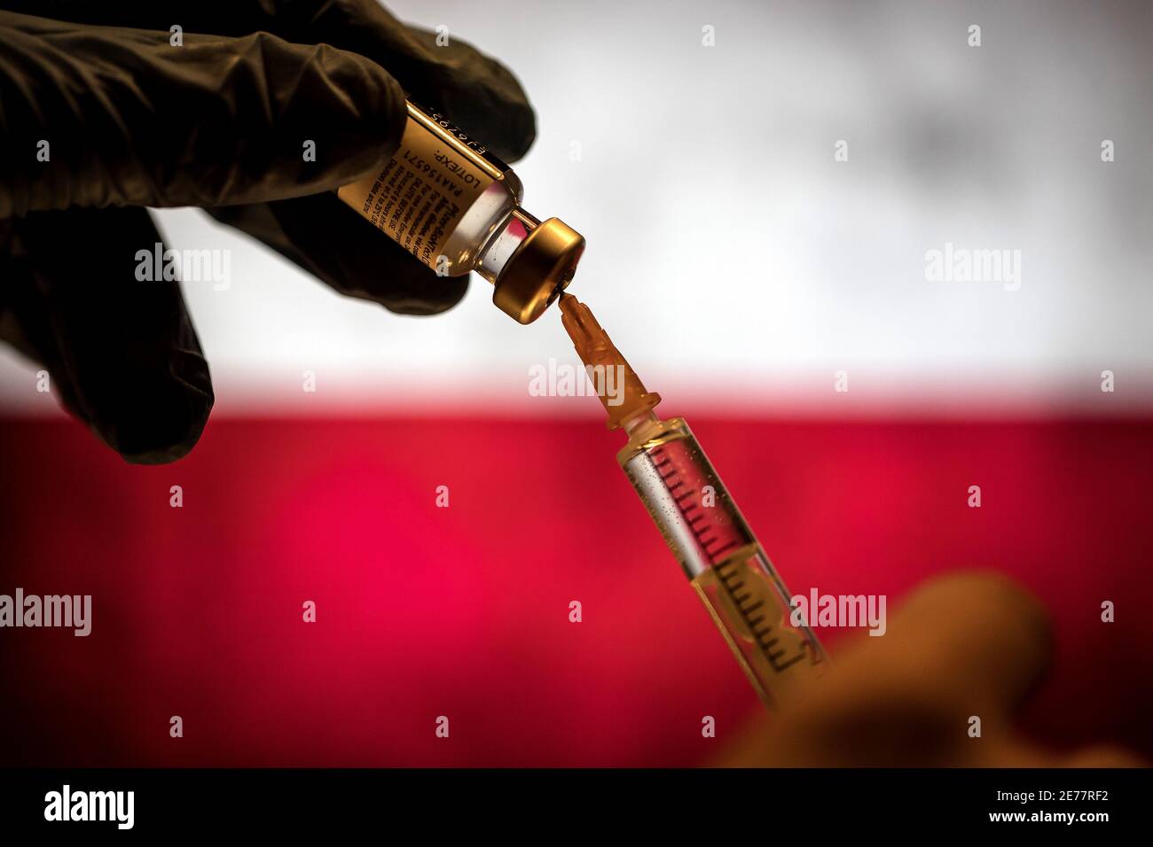 In this photo illustration a vial of Pfizer-BioNtech COVID-19 vaccine ...