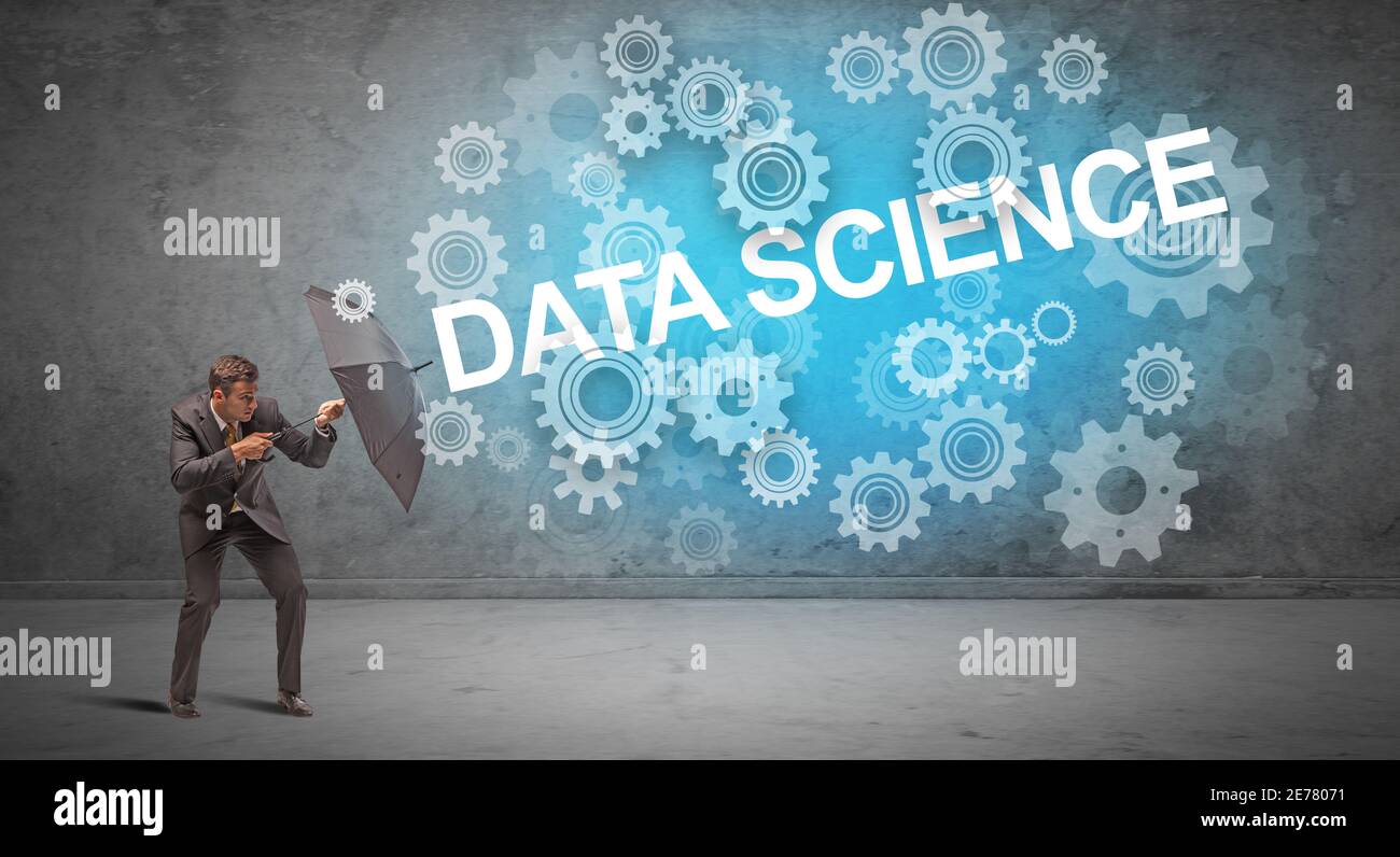 Businessman defending with umbrella from DATA SCIENCE inscription ...