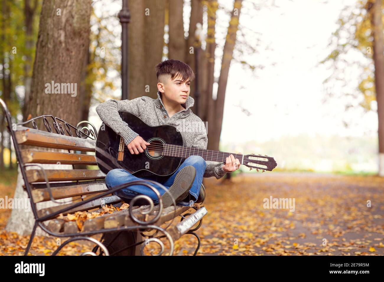Boy playing musical instruments hi-res stock photography and images - Alamy