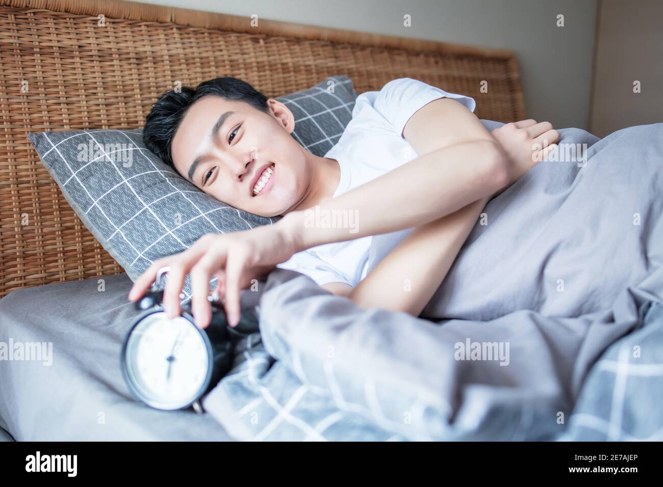 man stop alarm clock ringing Stock Photo - Alamy
