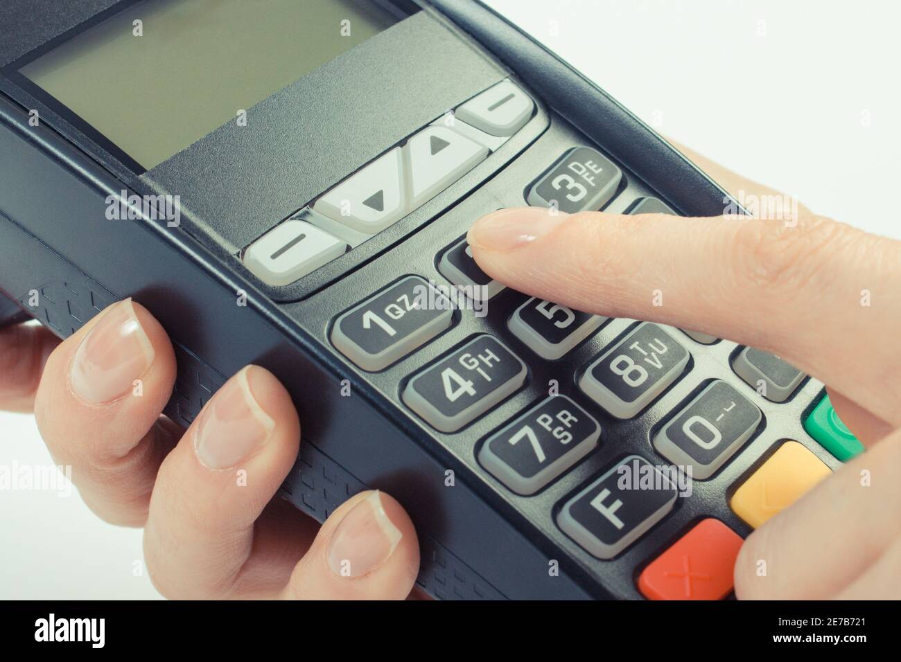 Hand of woman using payment terminal. Enter personal identification ...