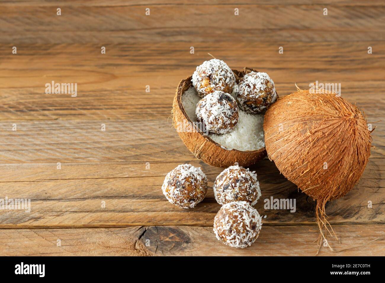 Healthy food concept. Homemade coconut energy balls in cocnut shell on ...