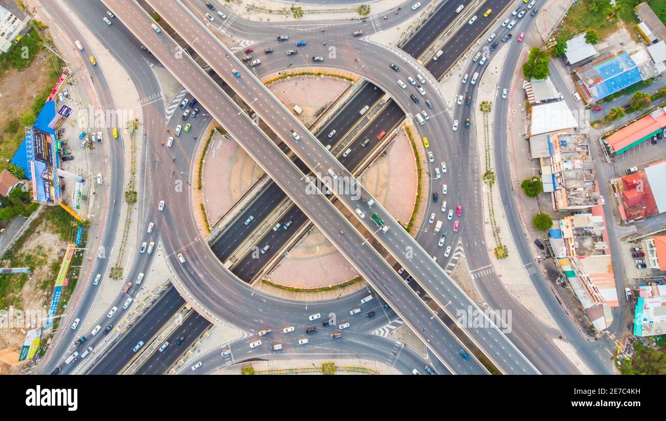 Circular junction cross transport road with car movement aerial view ...