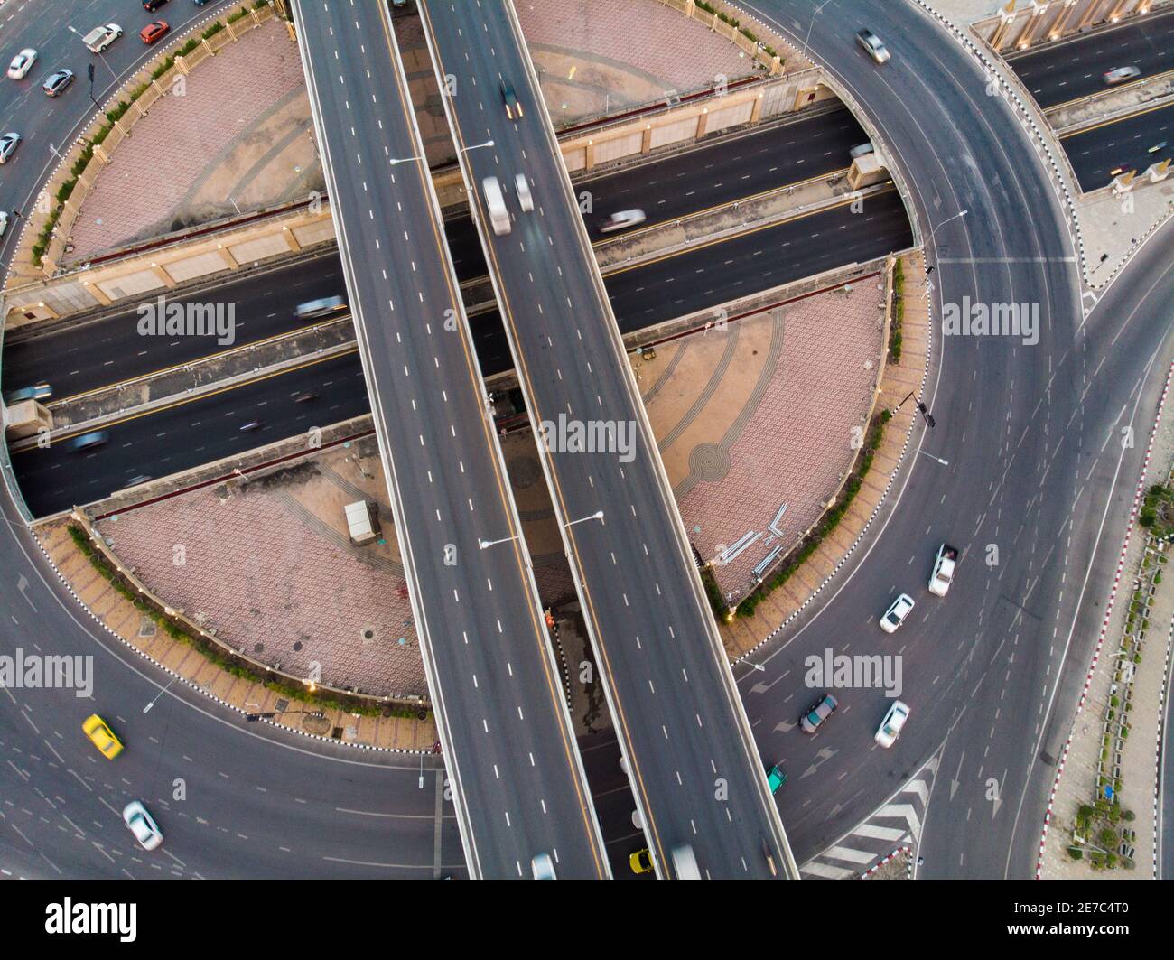 Circular junction cross transport road with car movement aerial view ...