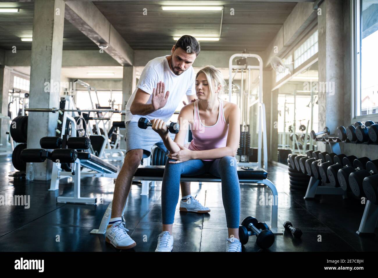 Muscular couple practice and talking in fitness gym healthy lifestyle ...
