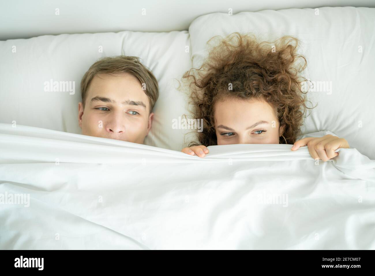 Happy caucasian couple sleeping relax on white bed romantic of love ...