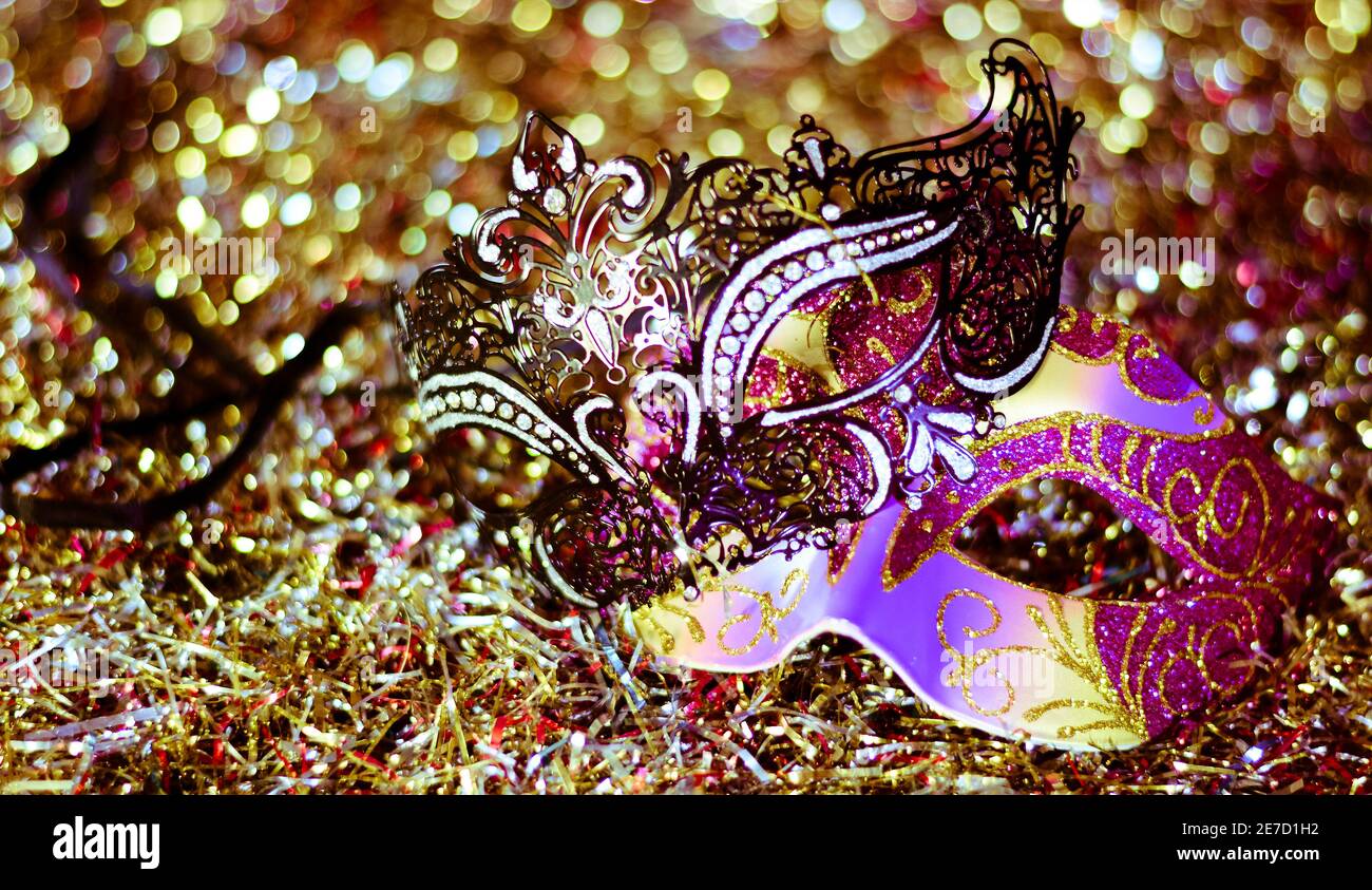 masks on streamers and confetti Stock Photo - Alamy