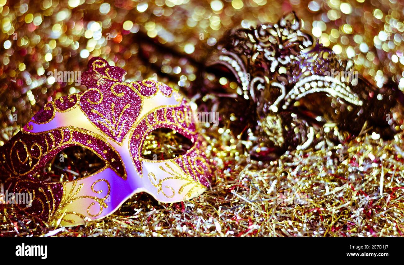 masks on streamers and confetti Stock Photo - Alamy