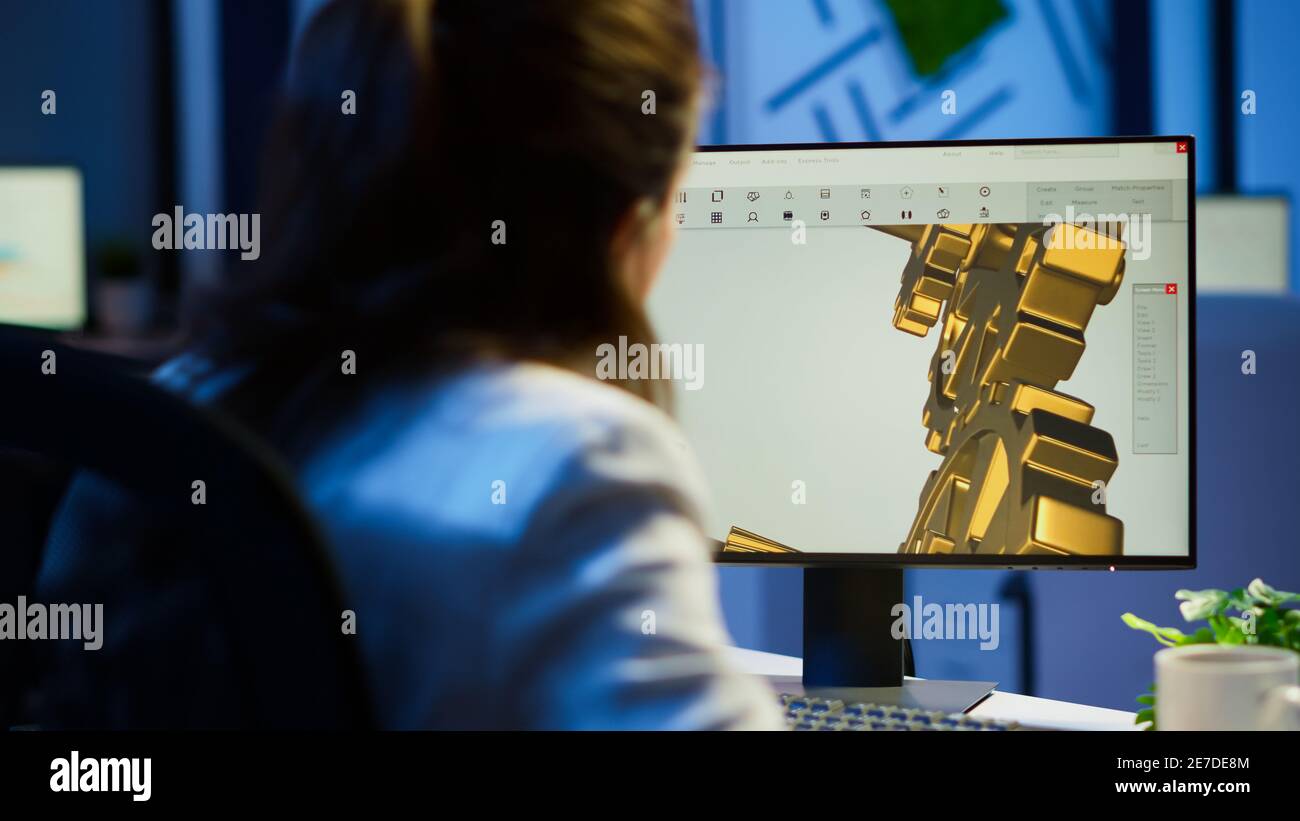 Focused woman architect working at new project using computer doing ...