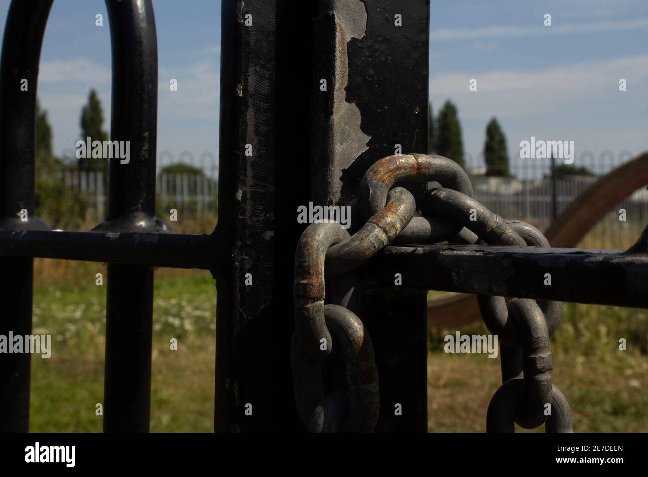 chained children's play park with railings and green background Stock ...