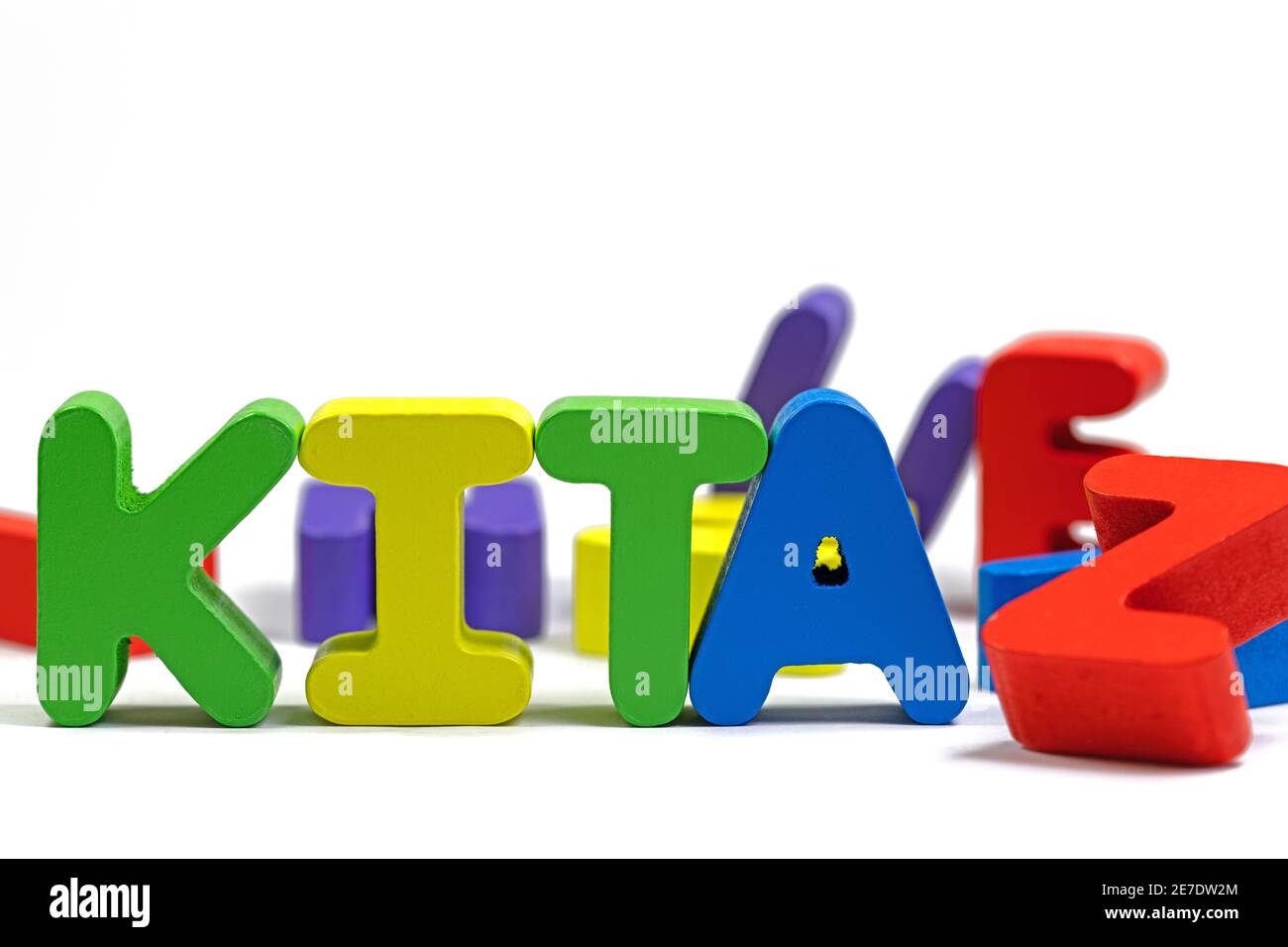 Colorful wooden letters against a white background Stock Photo - Alamy