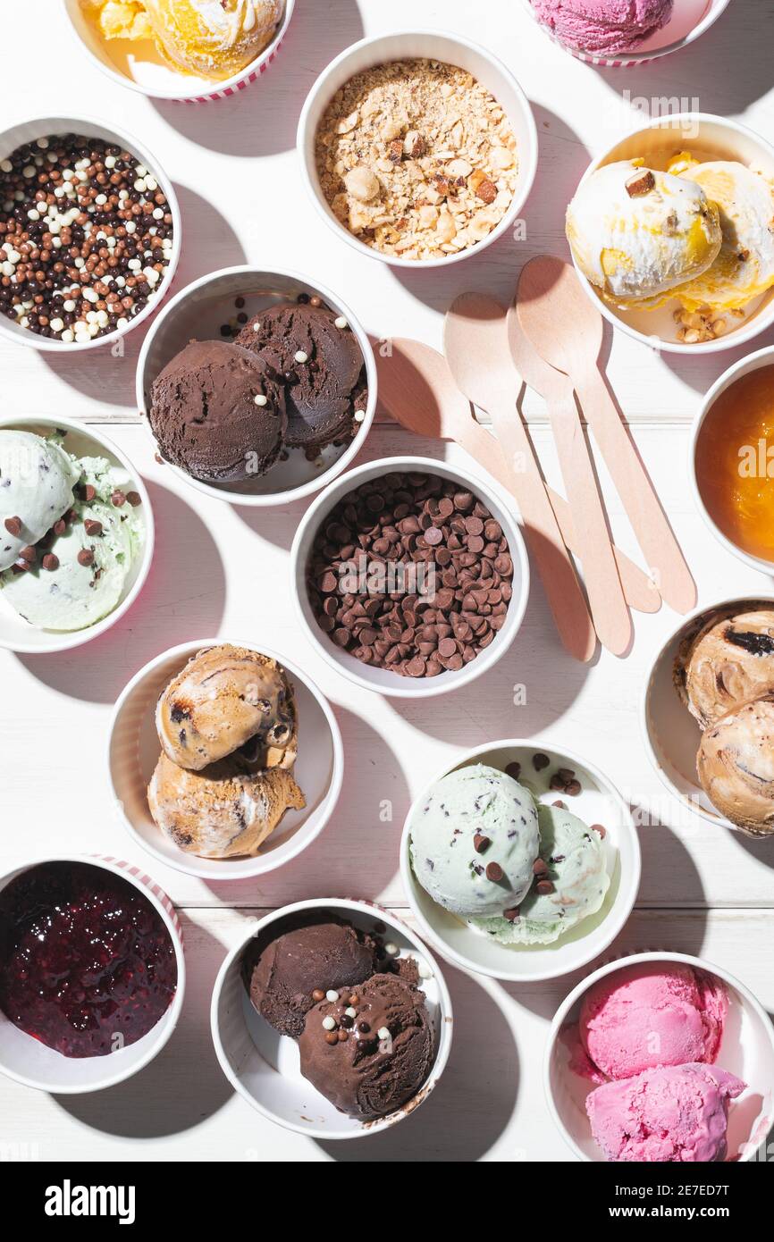 Vertical overhead shot of different flavors of ice cream in hard light ...