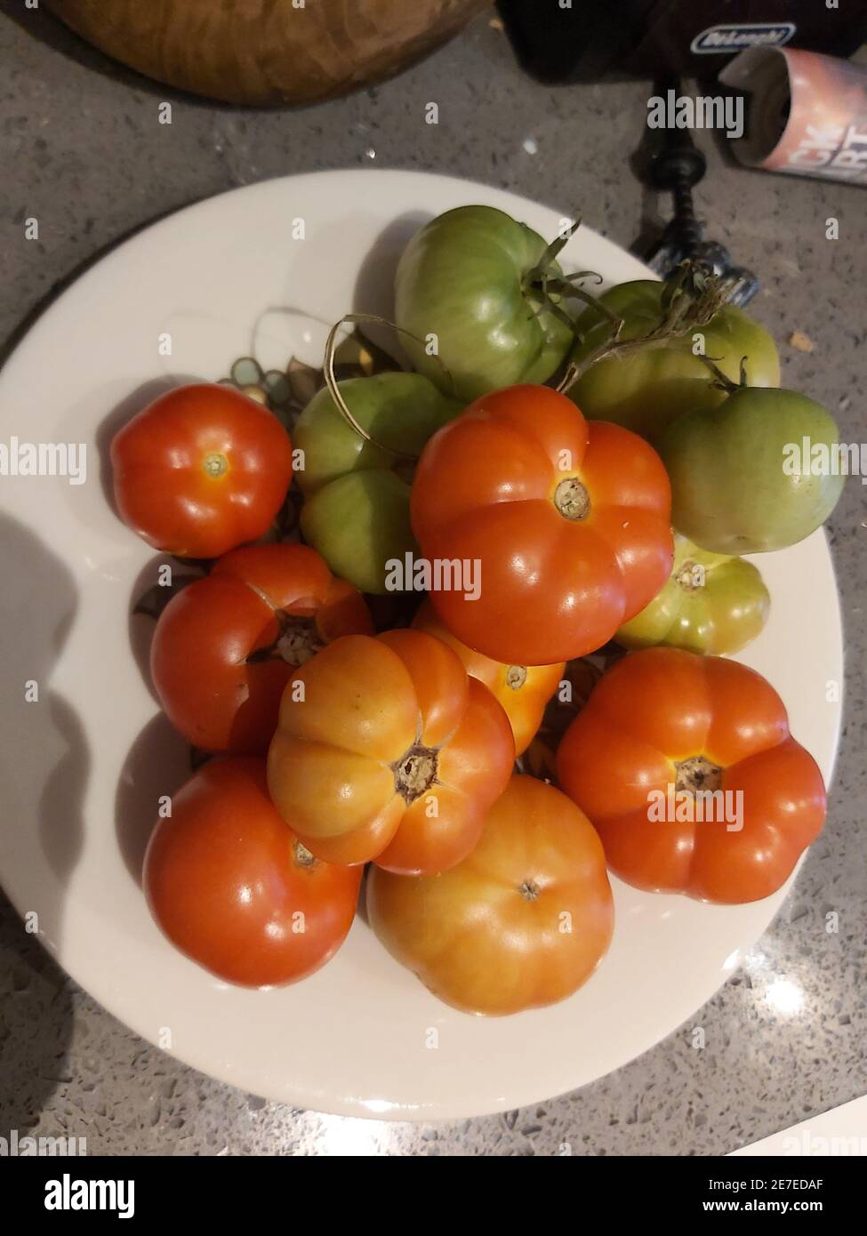 Homegrown fruit and vegetables sitting on the counter top Stock Photo ...
