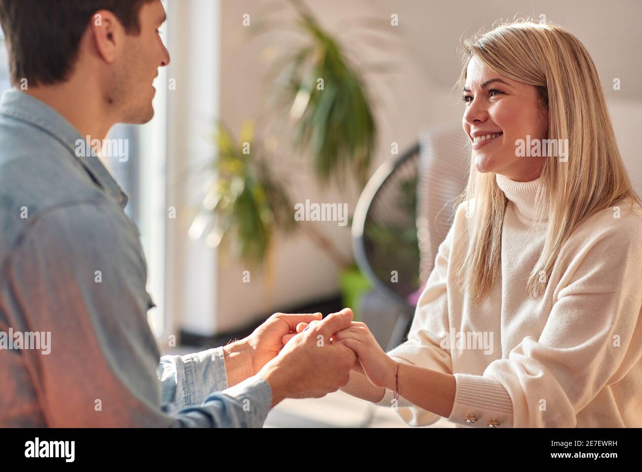 A young couple in moments of love in a relaxed atmosphere at home ...