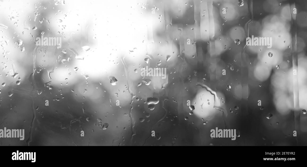 Rain storm through window of house Black and White Stock Photos ...
