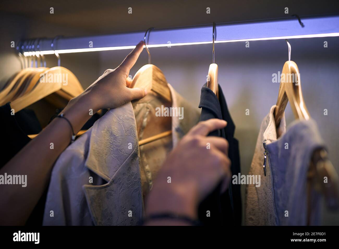 A business woman at hotel room who choosing clothes for work. Business ...