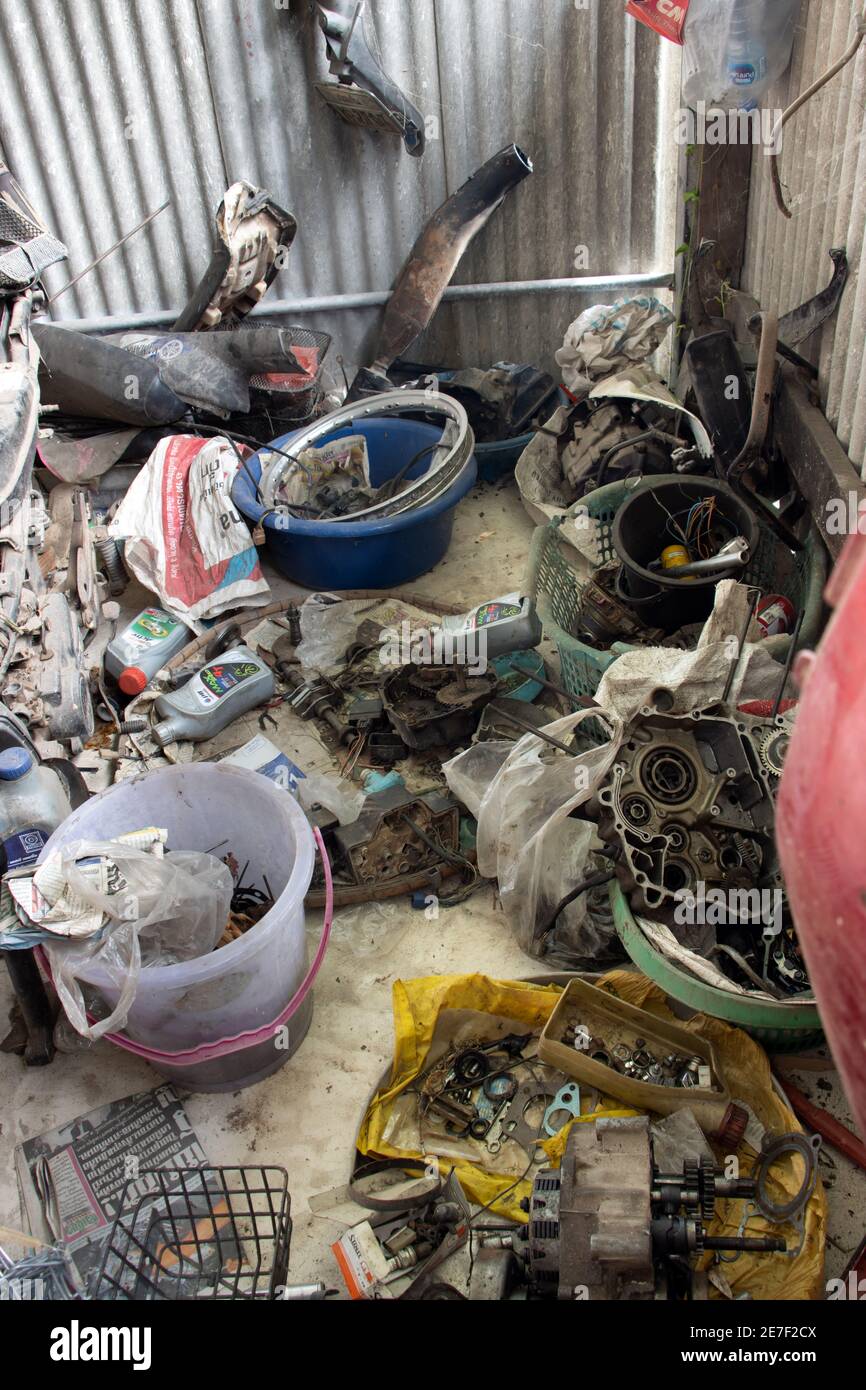 A dirty service workshop with parts of damaged vehicles Stock Photo - Alamy