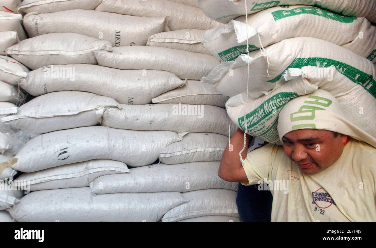 Man carrying rice bags hi-res stock photography and images - Alamy