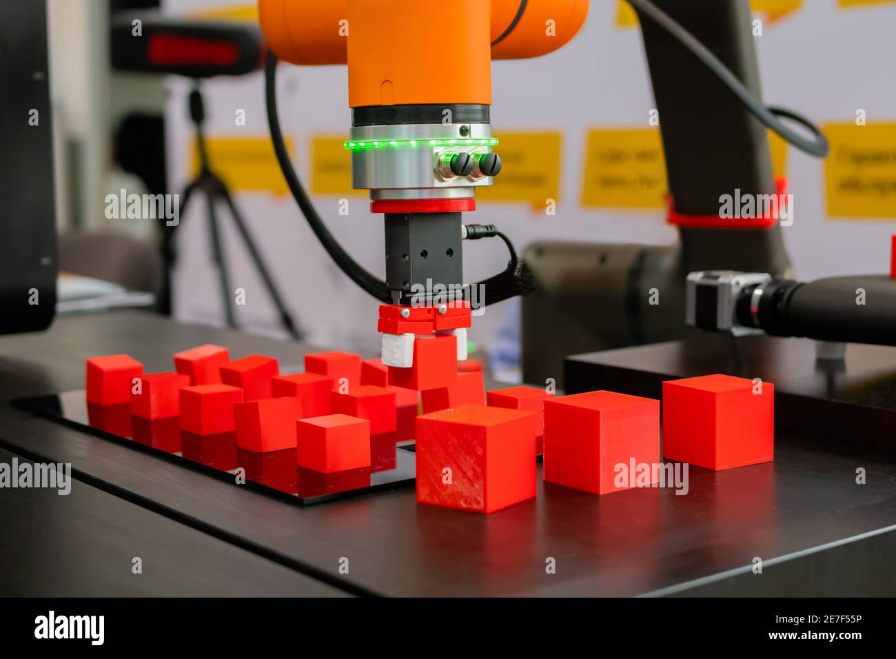Pick and place robotic arm manipulator moving red toy blocks at robot exhibition Stock Photo - Alamy