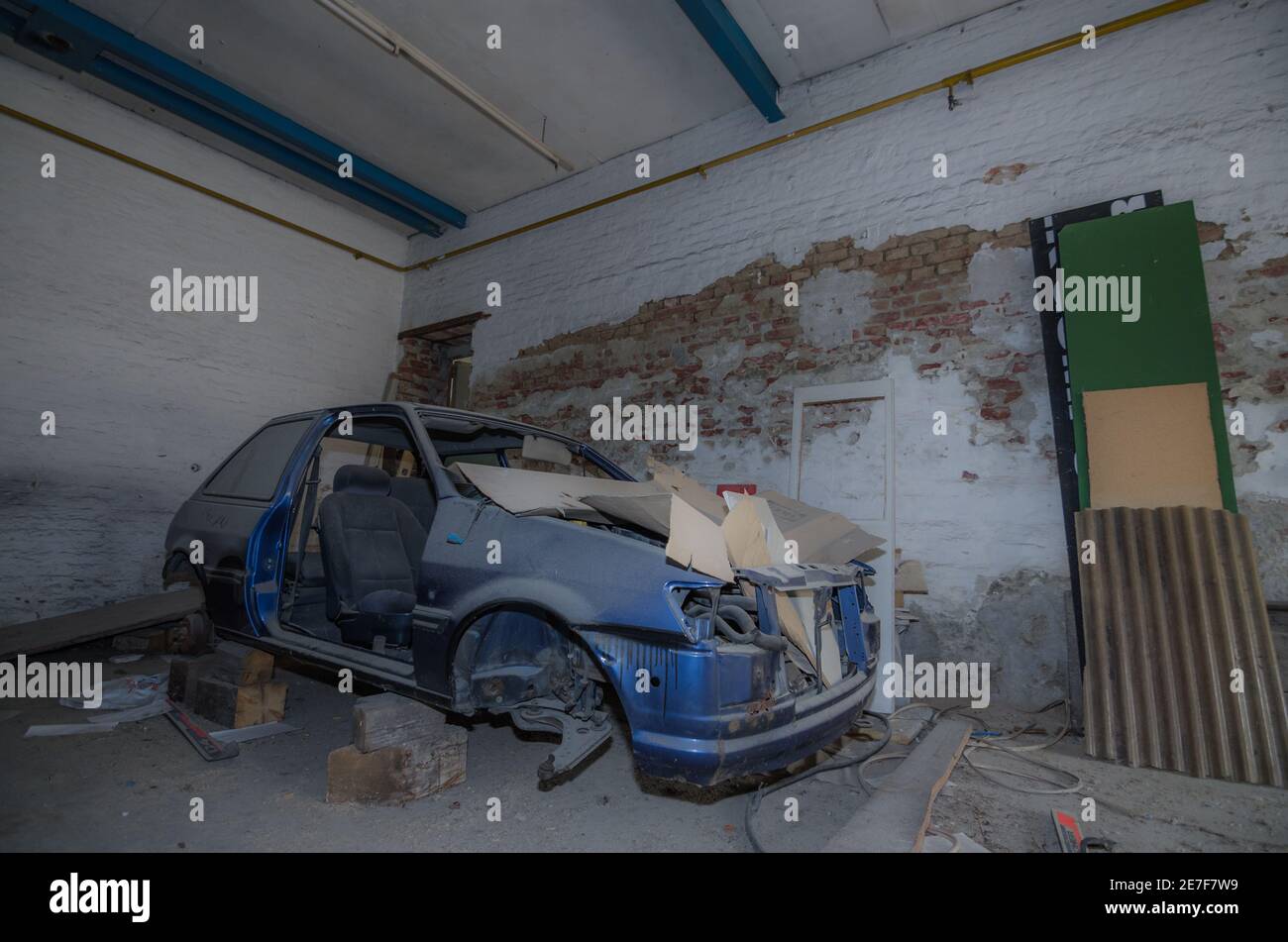 disassembled old blue car in a workshop Stock Photo - Alamy
