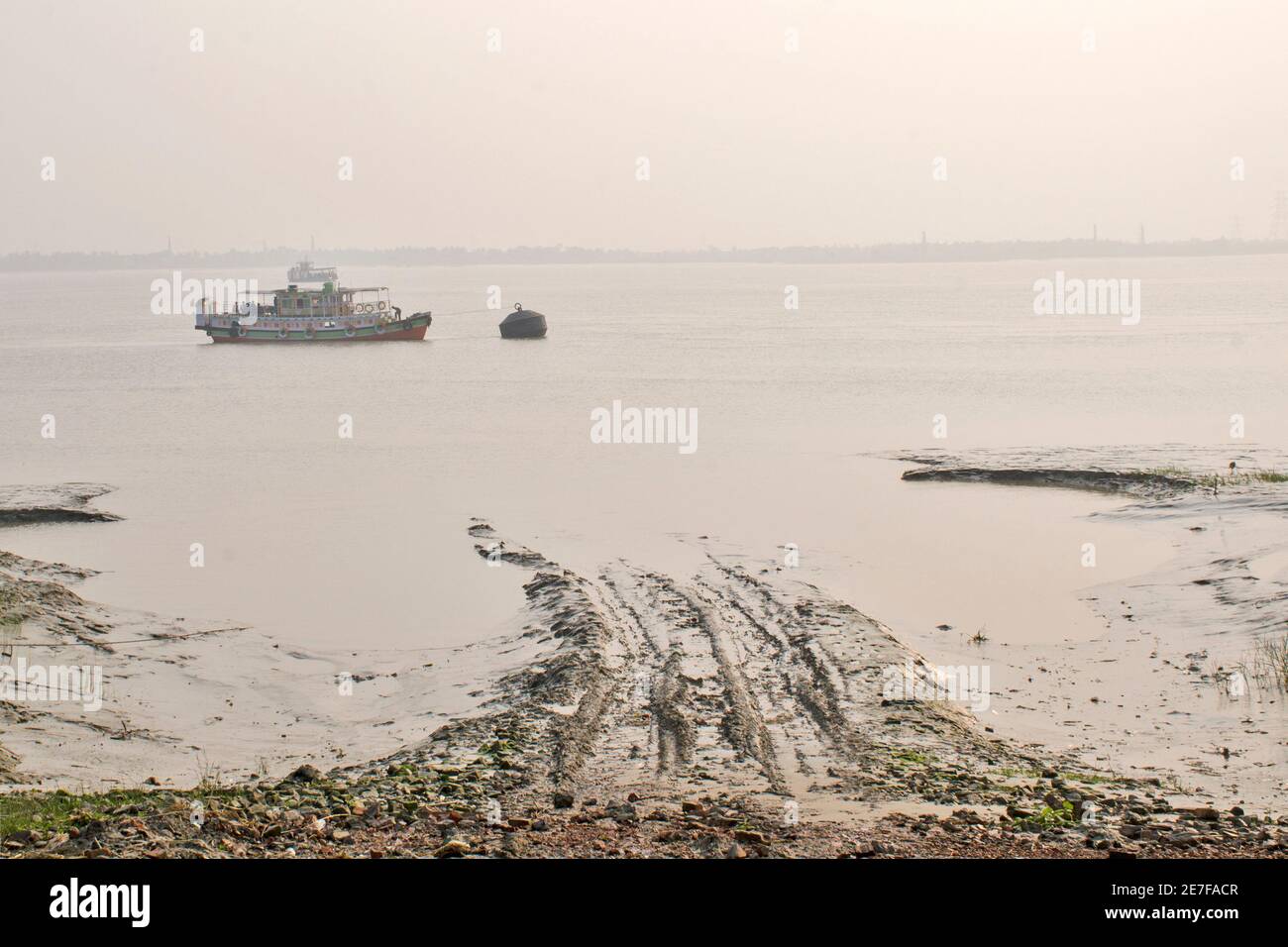 A vessel intercepted with a jetty on the Ganges at Diamond Harbor. It's ...