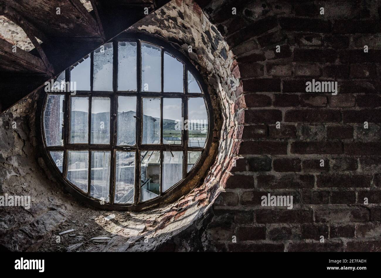 round window in an old abandoned factory Stock Photo - Alamy