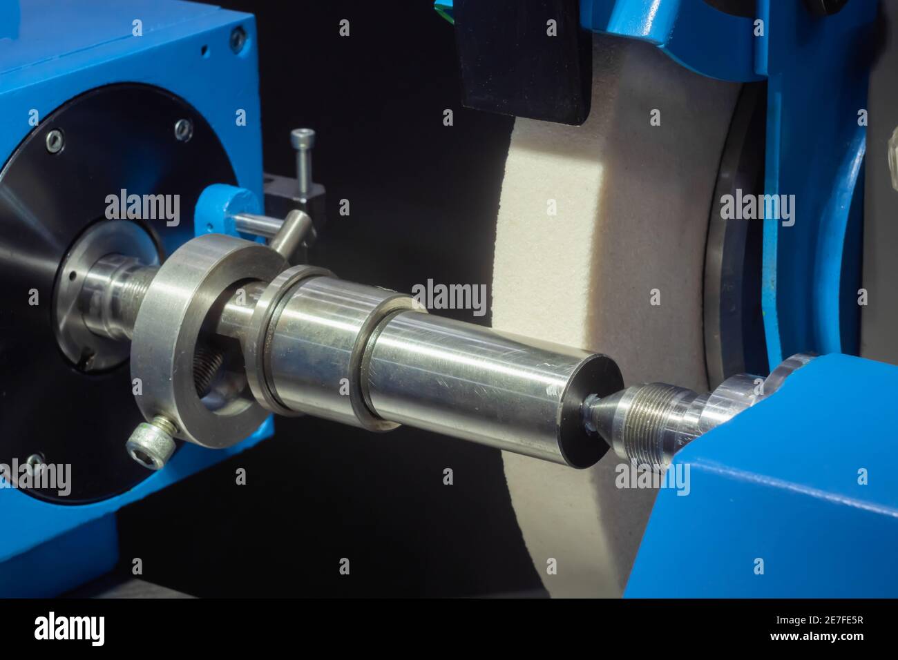 Surface grinding wheel machine working with metal workpiece at factory ...